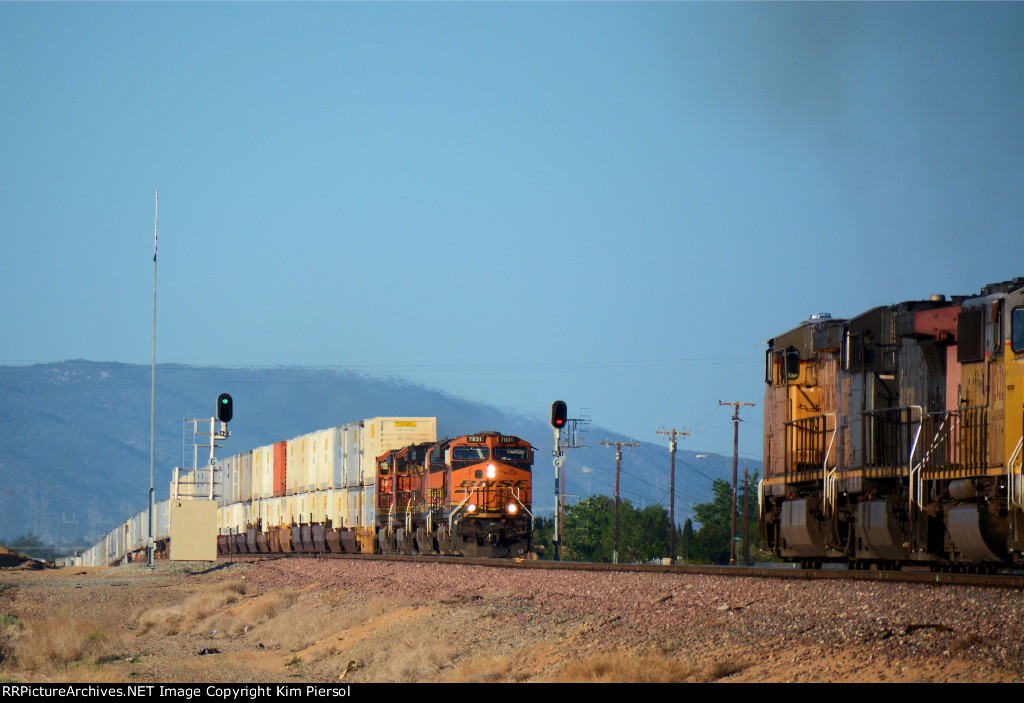 BNSF 7831 Passing UP Coal Drag